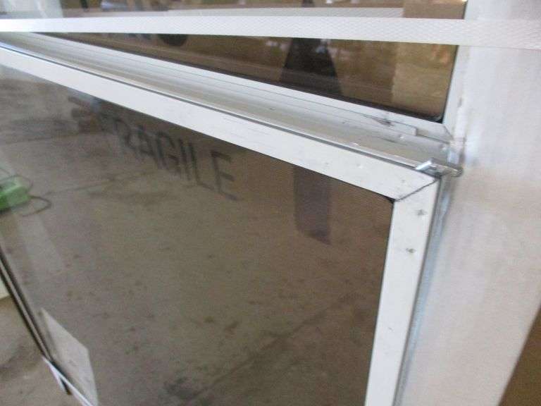 Larson exterior storm window, 32" x 66" - Albrecht Auction Service