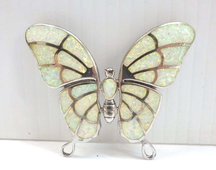 25g butterfly pendant with fire opals, .925 silver, Except where ...