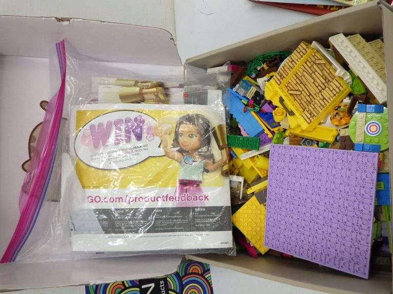 Multiple sets of Legos with directions; Cribbage board; Collection of ...