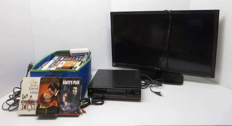 Flat screen TV; VCR; Box of movies; Various connector cords, in good ...