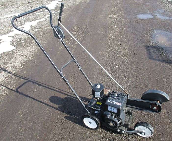 White outdoor sidewalk edger, 2 HP Briggs engine, good blade and belt ...