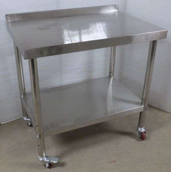 Stainless steel food prep table, lightly used in food packaging ...