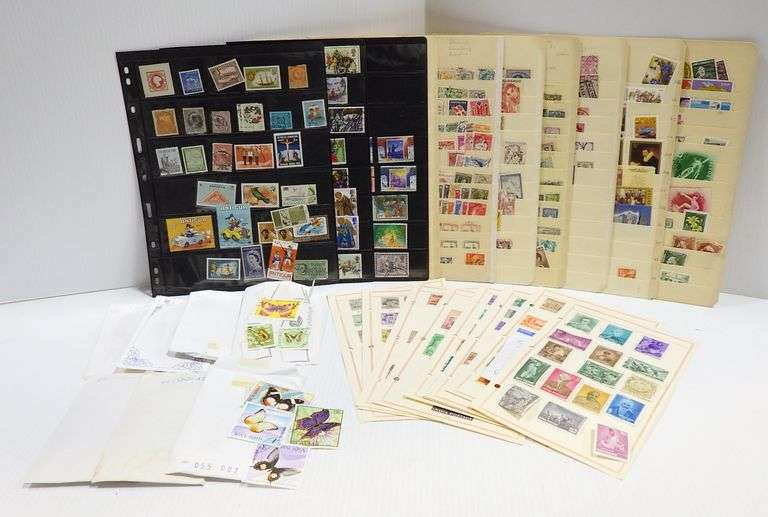 Bag of international stamps, and a smaller envelopes full of stamps ...