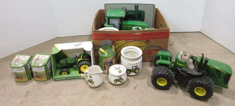 John Deere items, include: Toy tractors, Cookie jar tractors, Various ...