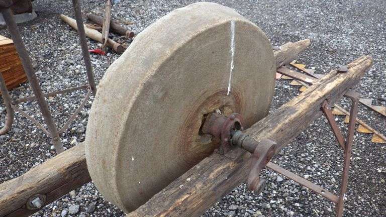 Large sharpening stone on platform - Albrecht Auction Service