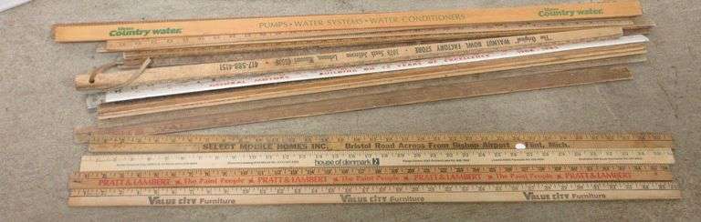 Assorted antique advertising yardsticks - Albrecht Auction Service