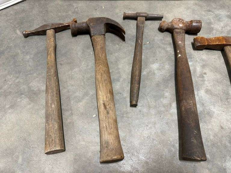 Assorted hammers, mallets, and a pickaxe - Albrecht Auction Service
