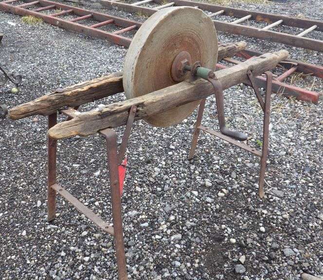 Large sharpening stone on platform - Albrecht Auction Service