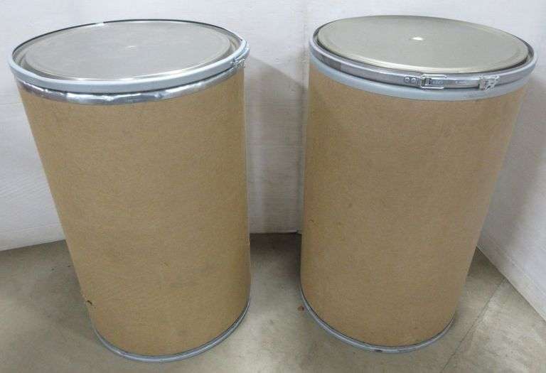 (2) Cardboard barrels with steel bottom and locking lids, one has a ...