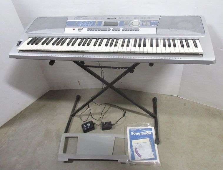 Yamaha portable grand DGX-200 with original book, foot pedal, and stand ...