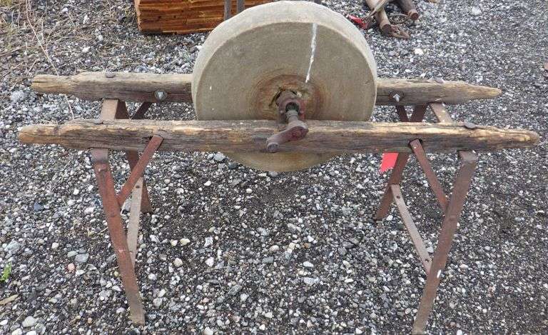 Large sharpening stone on platform - Albrecht Auction Service
