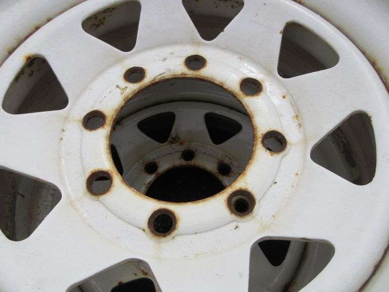 (4) GMC 16x7 8-hole rims/nuts - Albrecht Auction Service