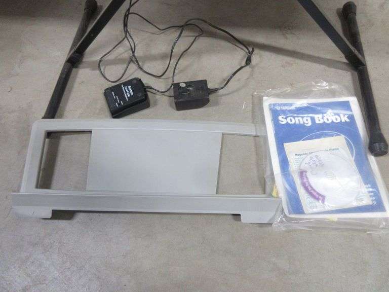 Yamaha portable grand DGX-200 with original book, foot pedal, and stand ...