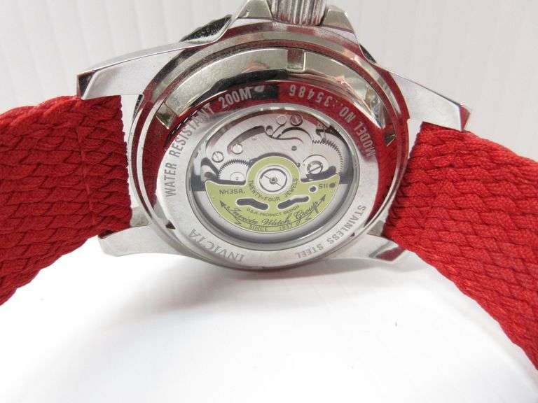 Invicta watch with black dial, and see through back, Seiko Movement red ...