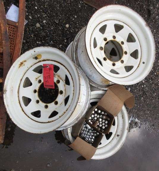 (4) GMC 16x7 8-hole rims/nuts - Albrecht Auction Service