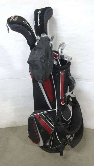 Golf equipments, includes: Maxfli bag with automatic stand, Taylormade ...