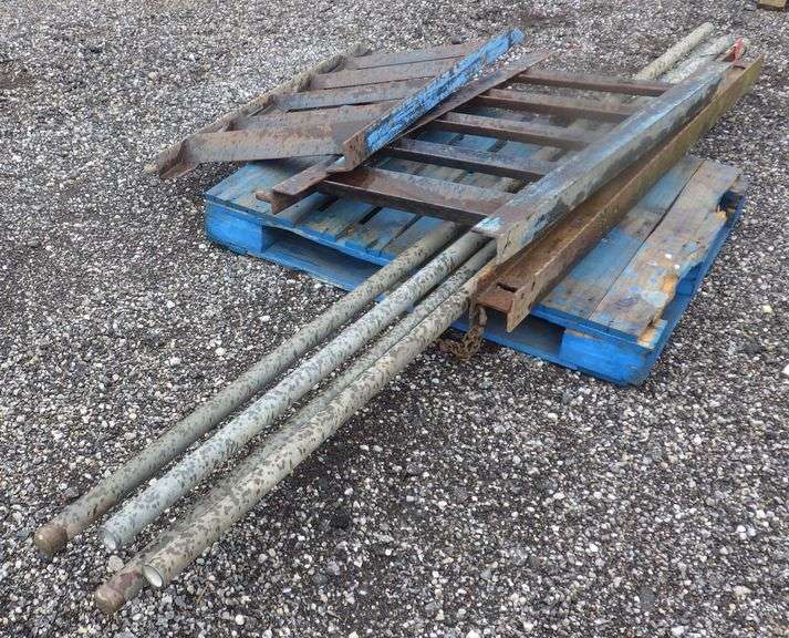(4) Pipes, 1 1/2" x 10'; (2) Heavy angle iron trailer ramps, approx. 4 ...