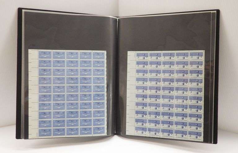 Collection of U.S. mint never hinged stamp full sheets in a black Itoya ...