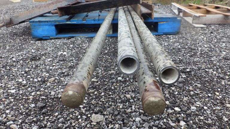 (4) Pipes, 1 1/2" x 10'; (2) Heavy angle iron trailer ramps, approx. 4 ...