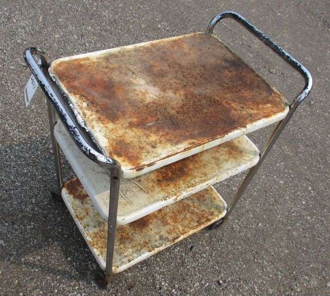 Three-tier roll around cart, shows age but still rolls, rusty ...