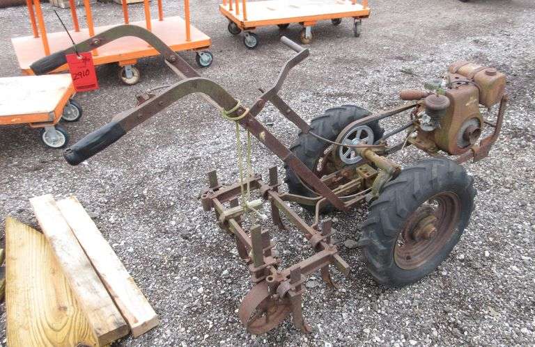 Older walk behind garden tractor with Clinton motor, engine turns over ...
