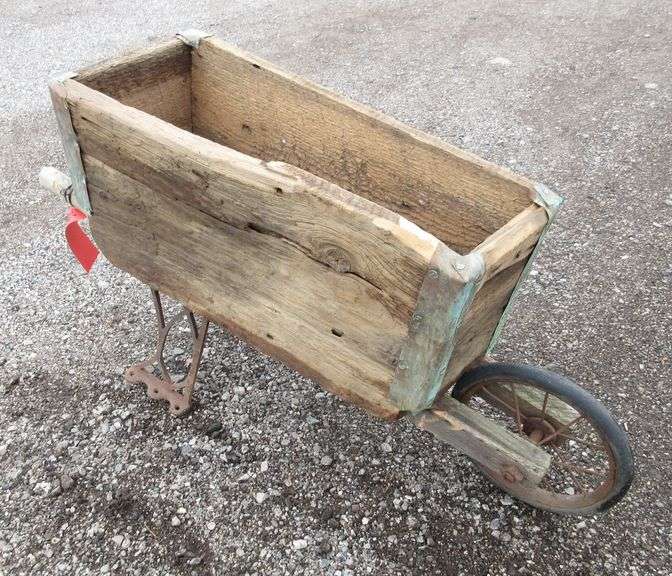 Very old wooden wheelbarrow with steel legs and copper edging, 10"W x ...
