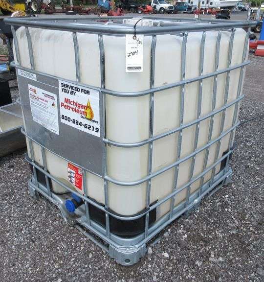 275-gallon poly tote, needs cleaned as it had motor oil in it, approx ...