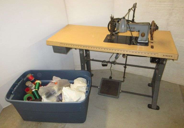 Vintage Singer chainstitch machine with table and bin of string and ...