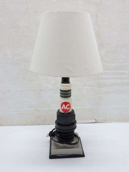 AC Spark plug table lamp, 20"H, works - Albrecht Auction Service