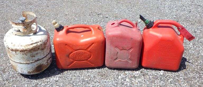 (3) 5-Gallon gas cans, and a propane tank - Albrecht Auction Service