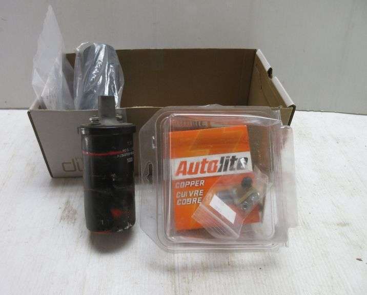 Assorted parts for an 8N Ford tractor, include: Carb rebuild kit, Plugs ...