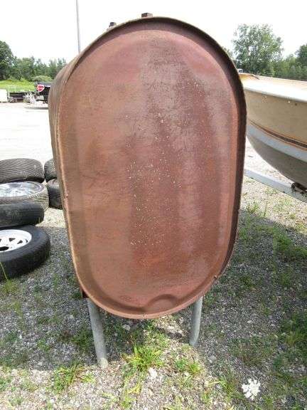 275-gallon oval fuel tank on legs, 52"W, good - Albrecht Auction Service