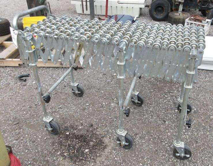 Rolling load dock conveyor - Albrecht Auction Service