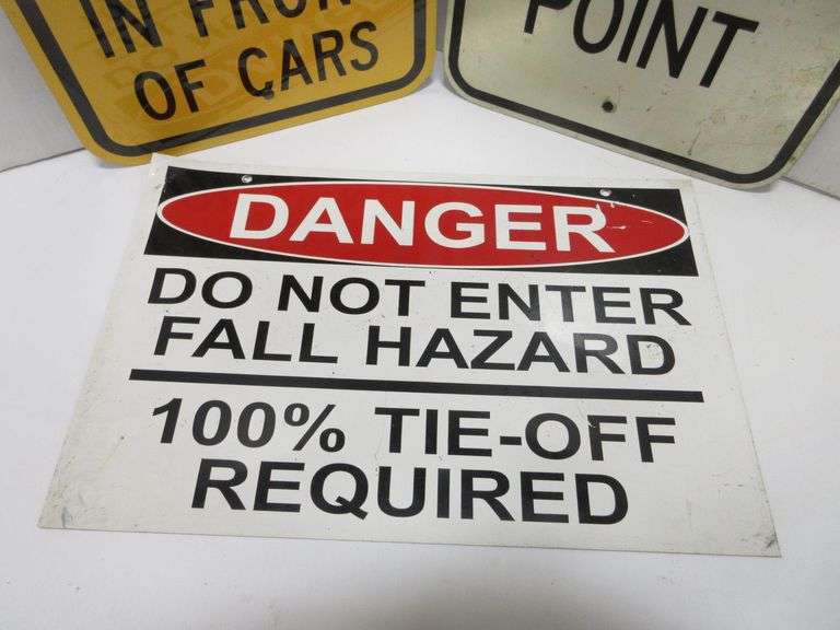 Signs, include: "Slow Down, Dog Runs In Front of Cars" metal sign; "No ...