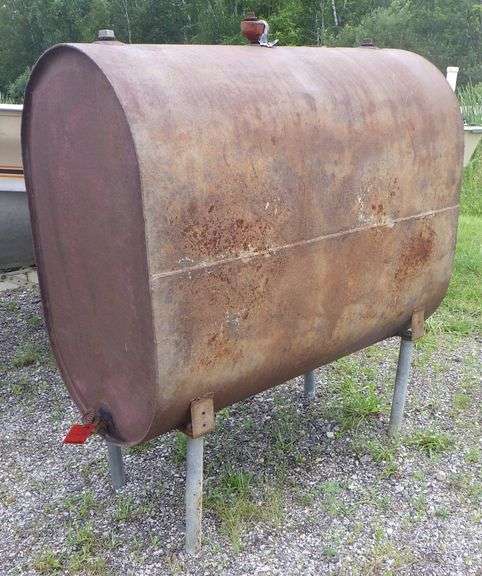 275-Gallon Oval fuel tank on legs, 52"W, good - Albrecht Auction Service