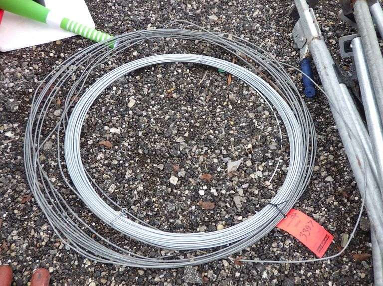(2) Rolls of thick steel wire, one roll is new - Albrecht Auction Service