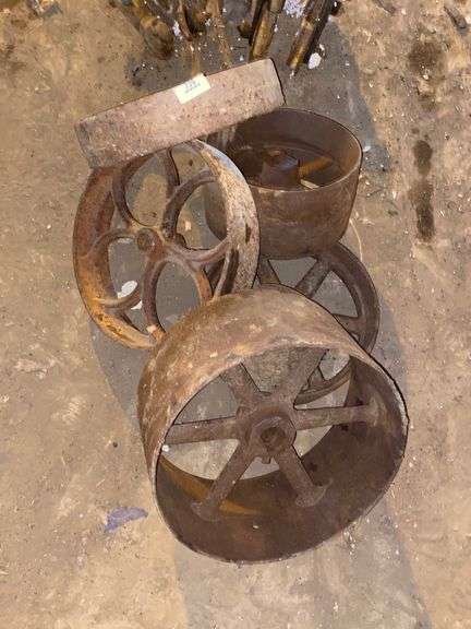 Pile Of Assorted Metal Wheels - Baer Auctioneers - Realty, LLC