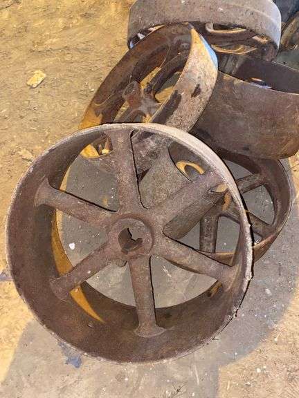 Pile Of Assorted Metal Wheels - Baer Auctioneers - Realty, LLC