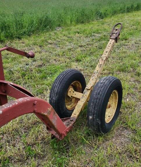 New Idea Bar Hay Rake with Dolly Wheel - Baker Auctions & Real Estate, LLC