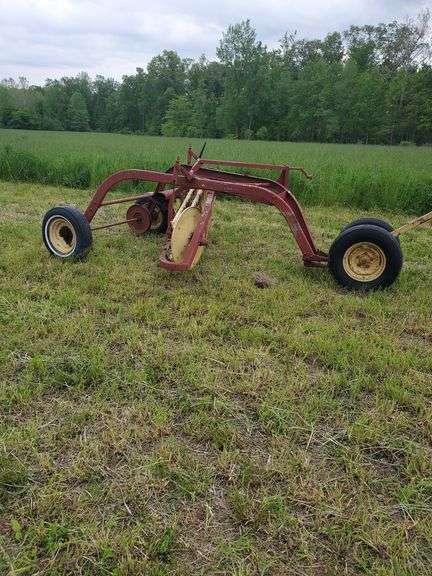 New Idea Bar Hay Rake with Dolly Wheel - Baker Auctions & Real Estate, LLC