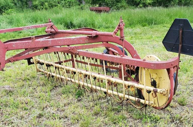 New Idea Bar Hay Rake with Dolly Wheel - Baker Auctions & Real Estate, LLC