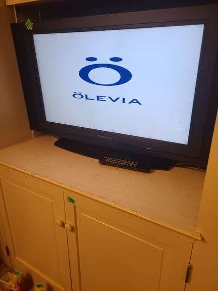 Olevia TV with remote - Baker Auctions & Real Estate, LLC