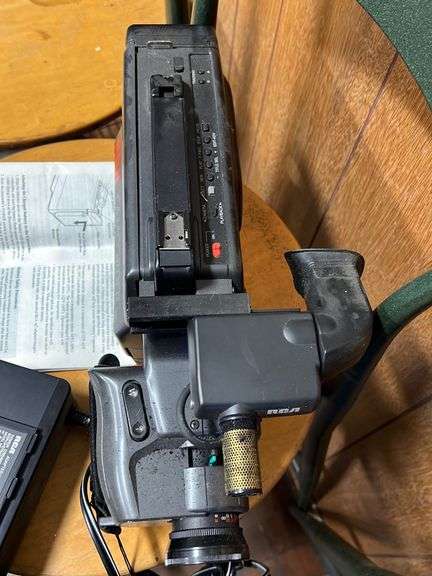 Old camcorder with battery and chargee - Baker Auctions & Real Estate, LLC