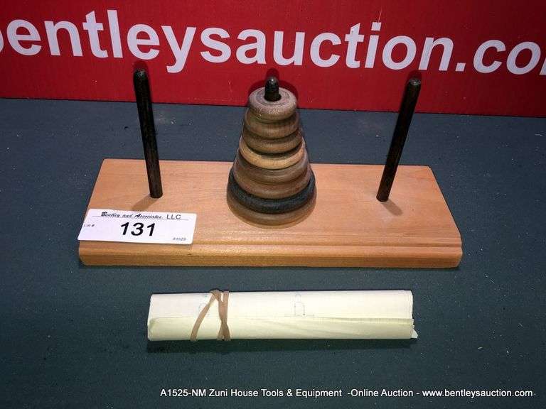 WOODEN DISK STACK PUZZLE GAME - Bentley & Associates, LLC