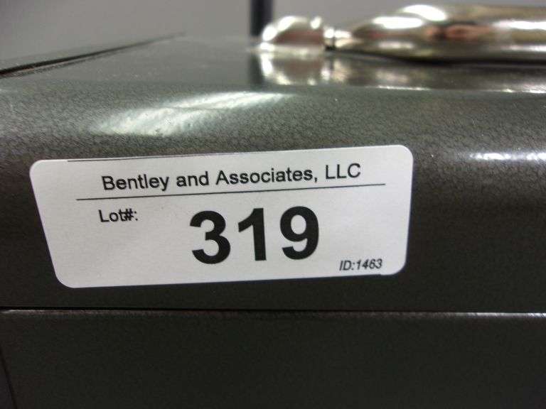 GRAY METAL LOCK STORAGE BOX - Bentley & Associates, LLC