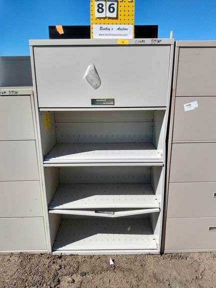 4-DRAWER CABINET - USED, AS IS, WEATHER DAMAGED - Bentley & Associates, LLC