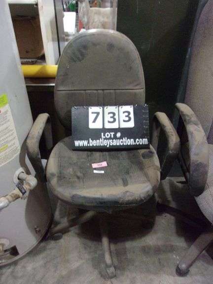 BLACK LEATHER CASTERED CHAIR - Bentley & Associates, LLC