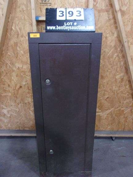 BROWN VERTICAL METAL GUN LOCK BOX - Bentley & Associates, LLC