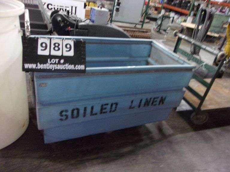 BLUE PLASTIC 4 WHEEL SOILED LINEN CART - Bentley & Associates, LLC