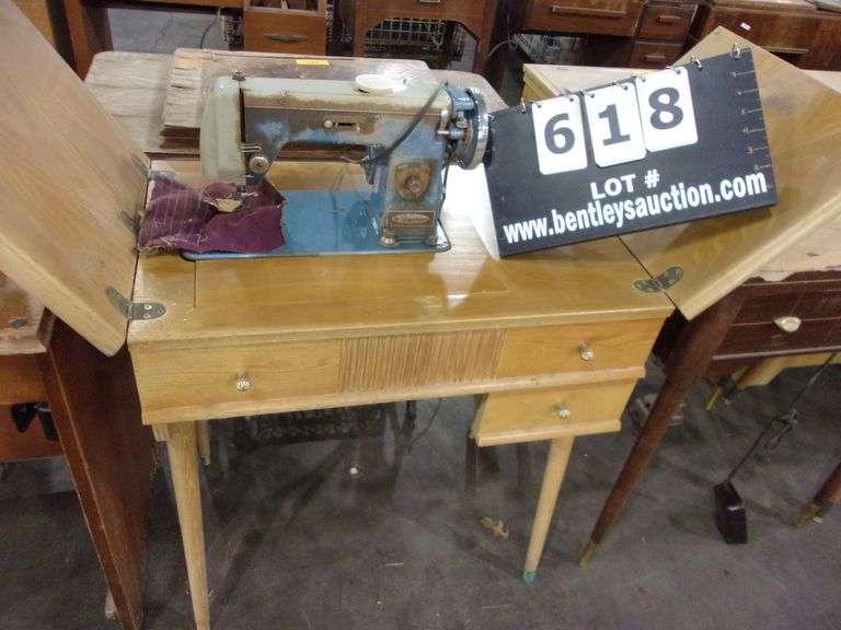 VINTAGE MONTGOMERY WARD SEWING MACHINE IN TABLE - Bentley & Associates, LLC
